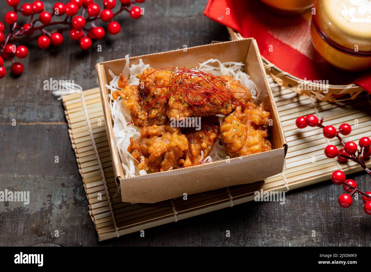 Japanese Tangyang Fried Chicken in a dish with chopsticks isolated on ...