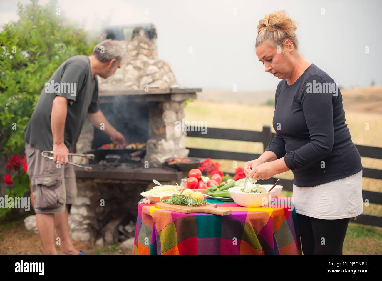 Happy family having barbecue garden hi-res stock photography and images ...