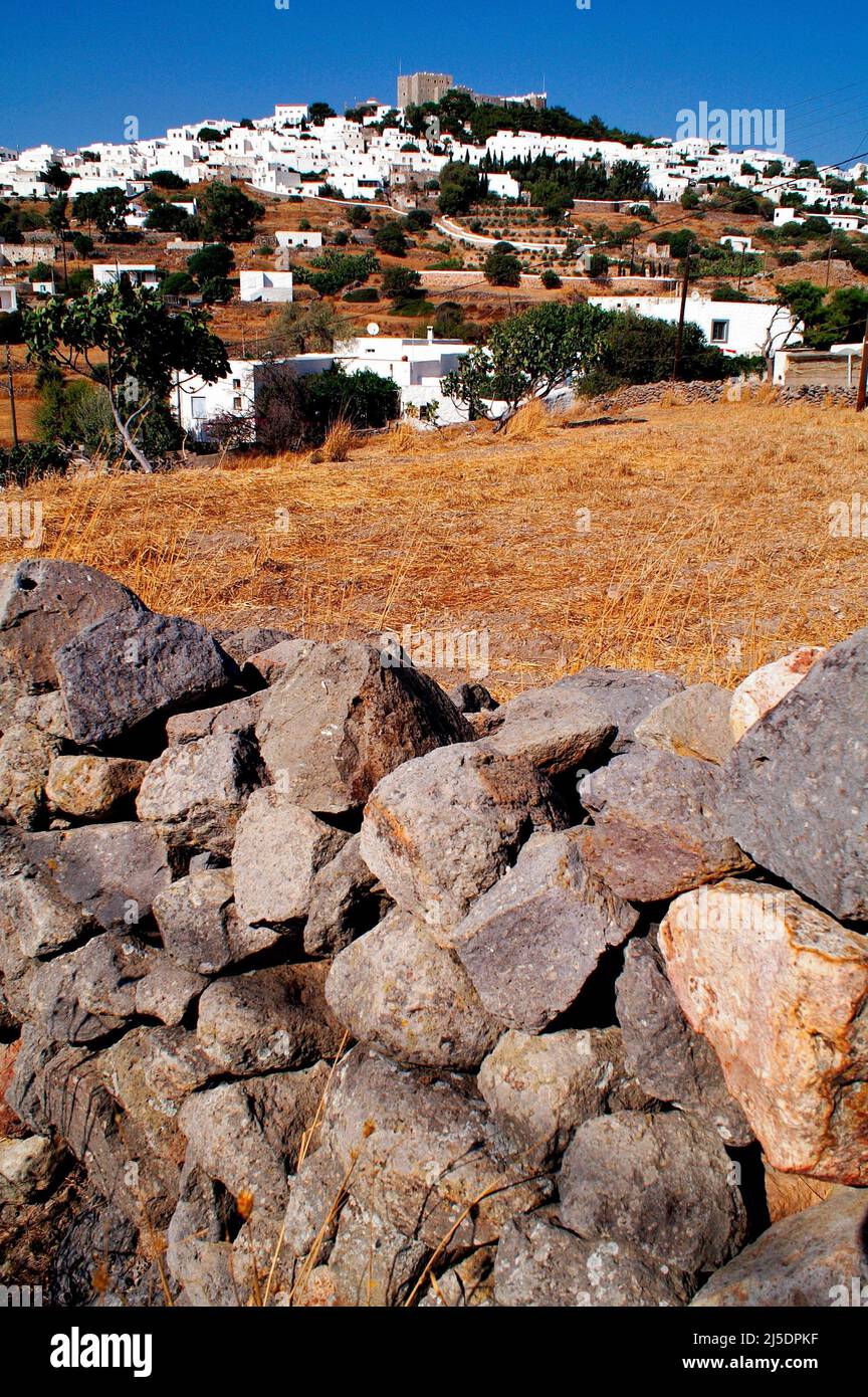Greece, Patmos island, stone-made wall with Hora town in the background ...
