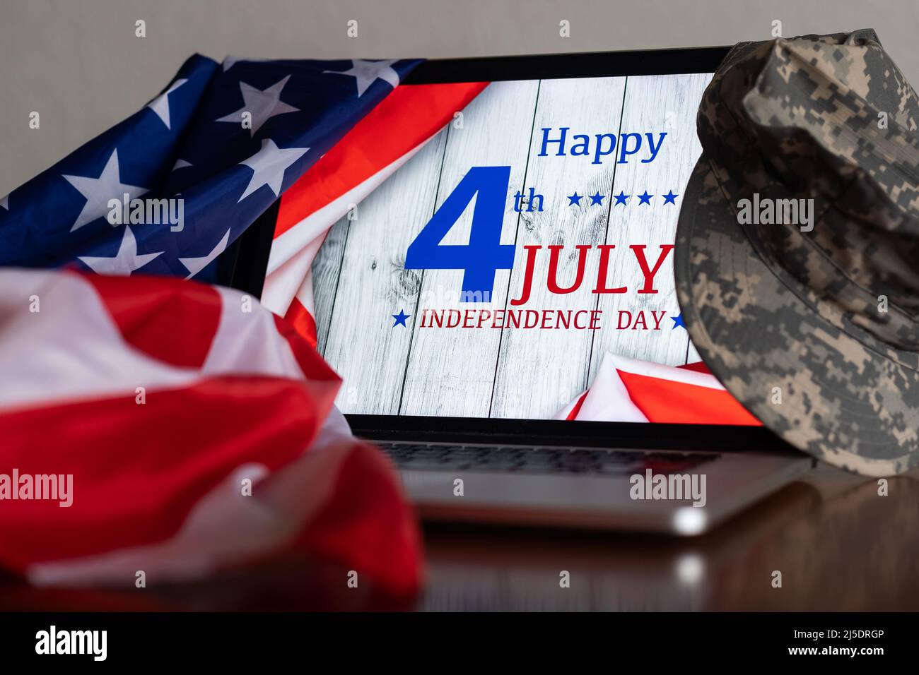 American flags with inscription Happy Independence Day on laptop Stock ...