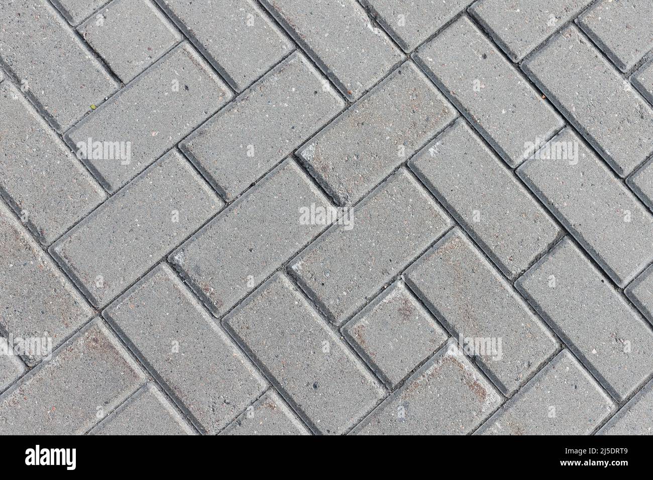 Gray cobblestone road pavement with rectangle concrete blocks, top view ...