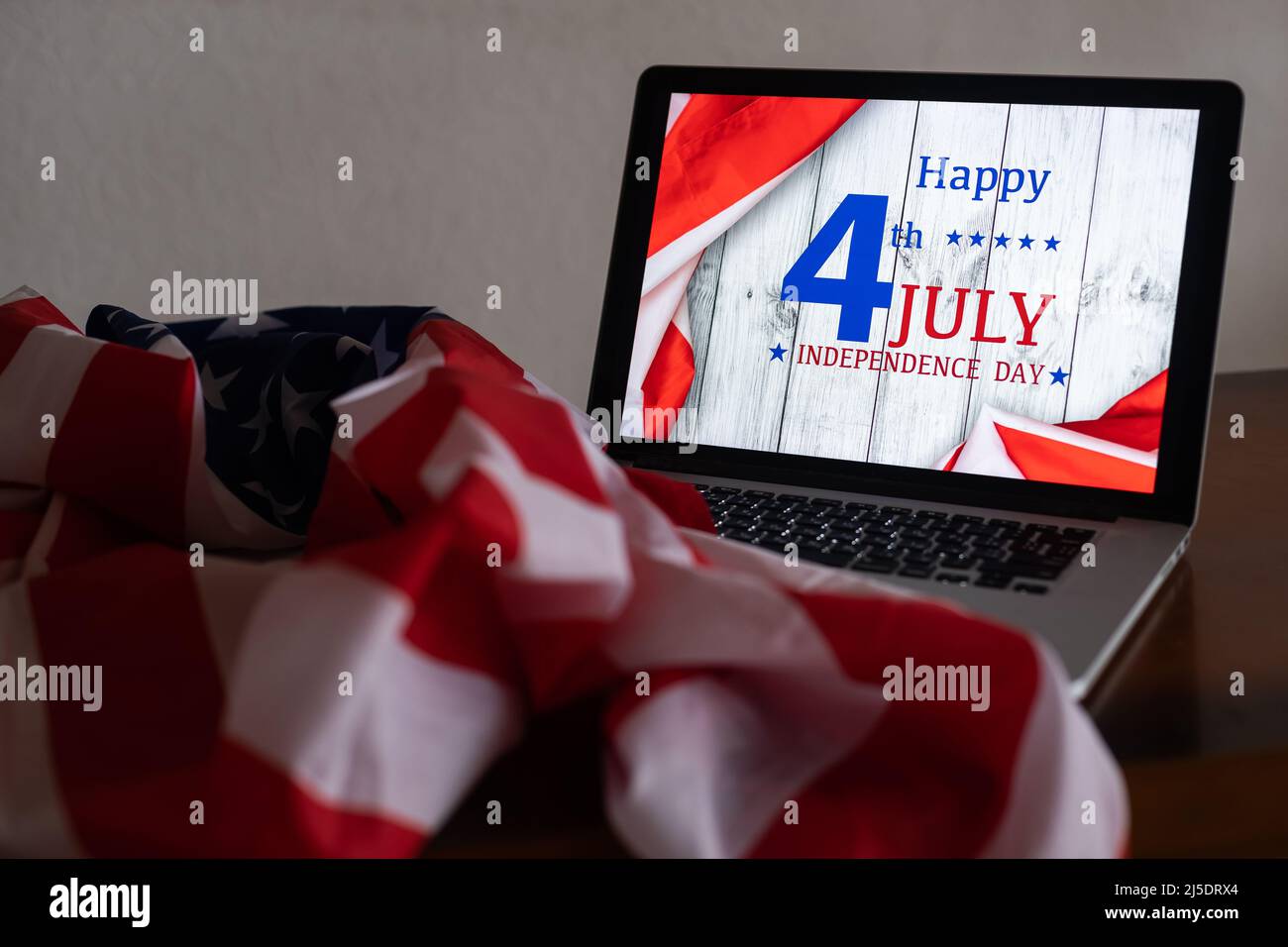 American flags with inscription Happy Independence Day on laptop Stock ...