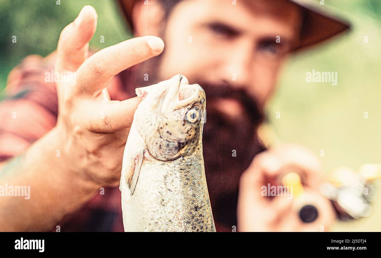 Fishing. Angler with fishing trophy. Fisherman and trout. Fishing ...
