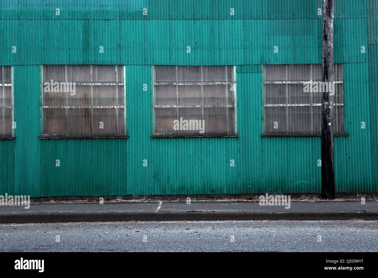 exterior view of old factory buidling with dirty windows Stock Photo ...