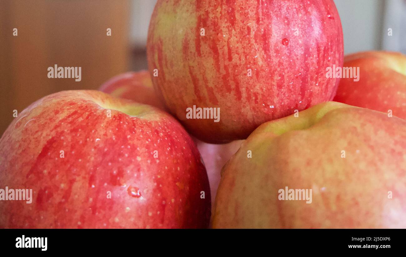 Gala apples stacked in a pile. Ripe fruit close-up Stock Photo - Alamy