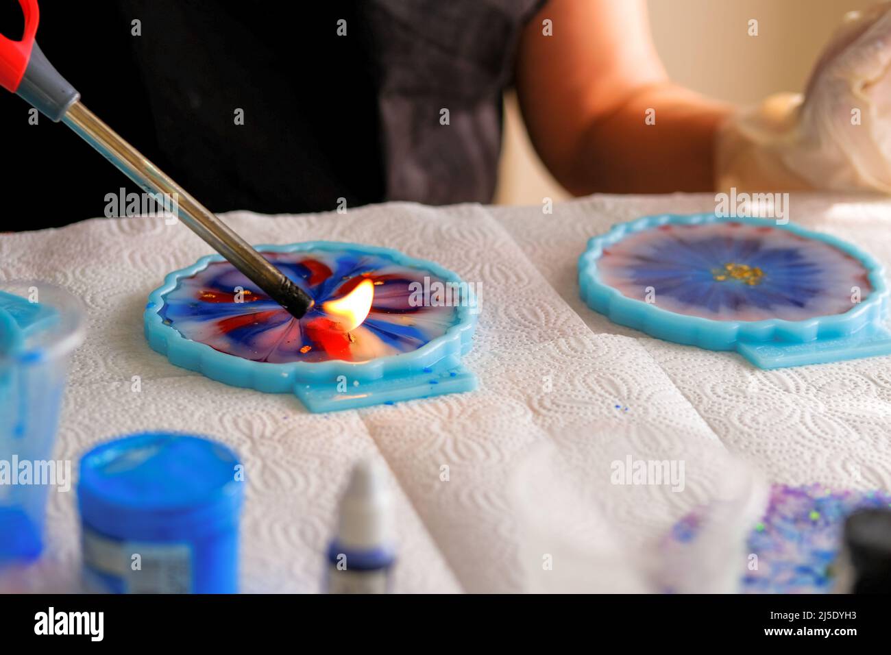 Woman making epoxy resin arts and crafts Stock Photo - Alamy