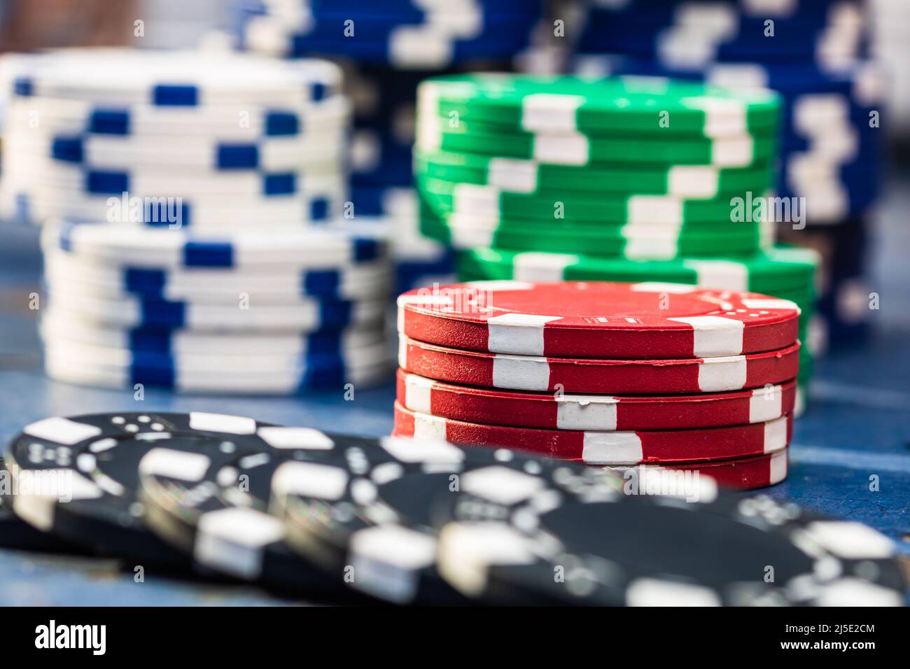 Stacks of poker chips detail with cards Stock Photo - Alamy