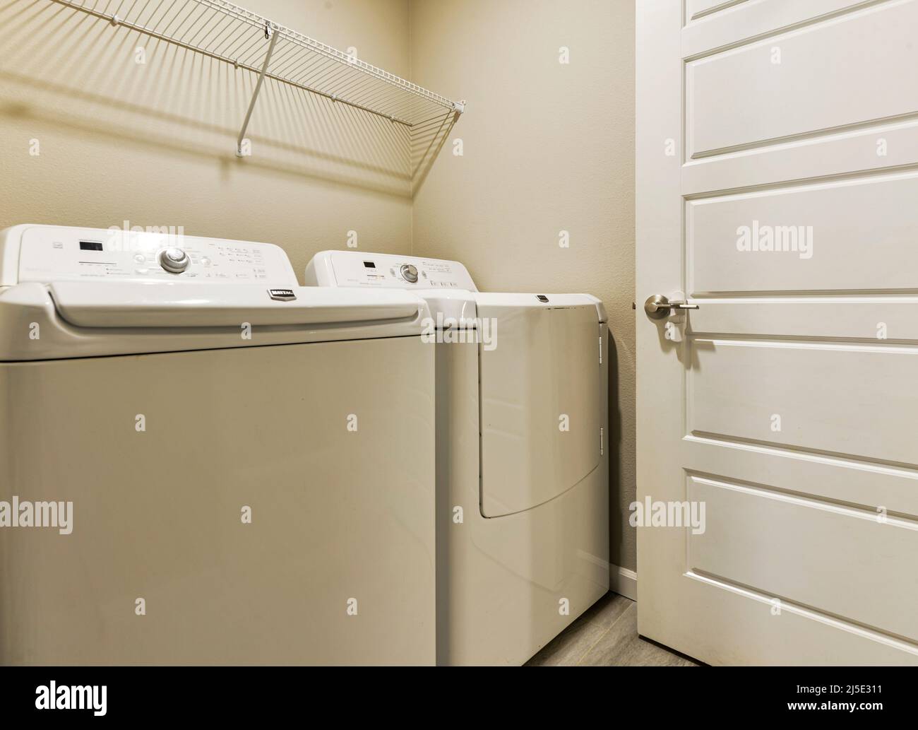 Modern residential laundry room interior Stock Photo - Alamy