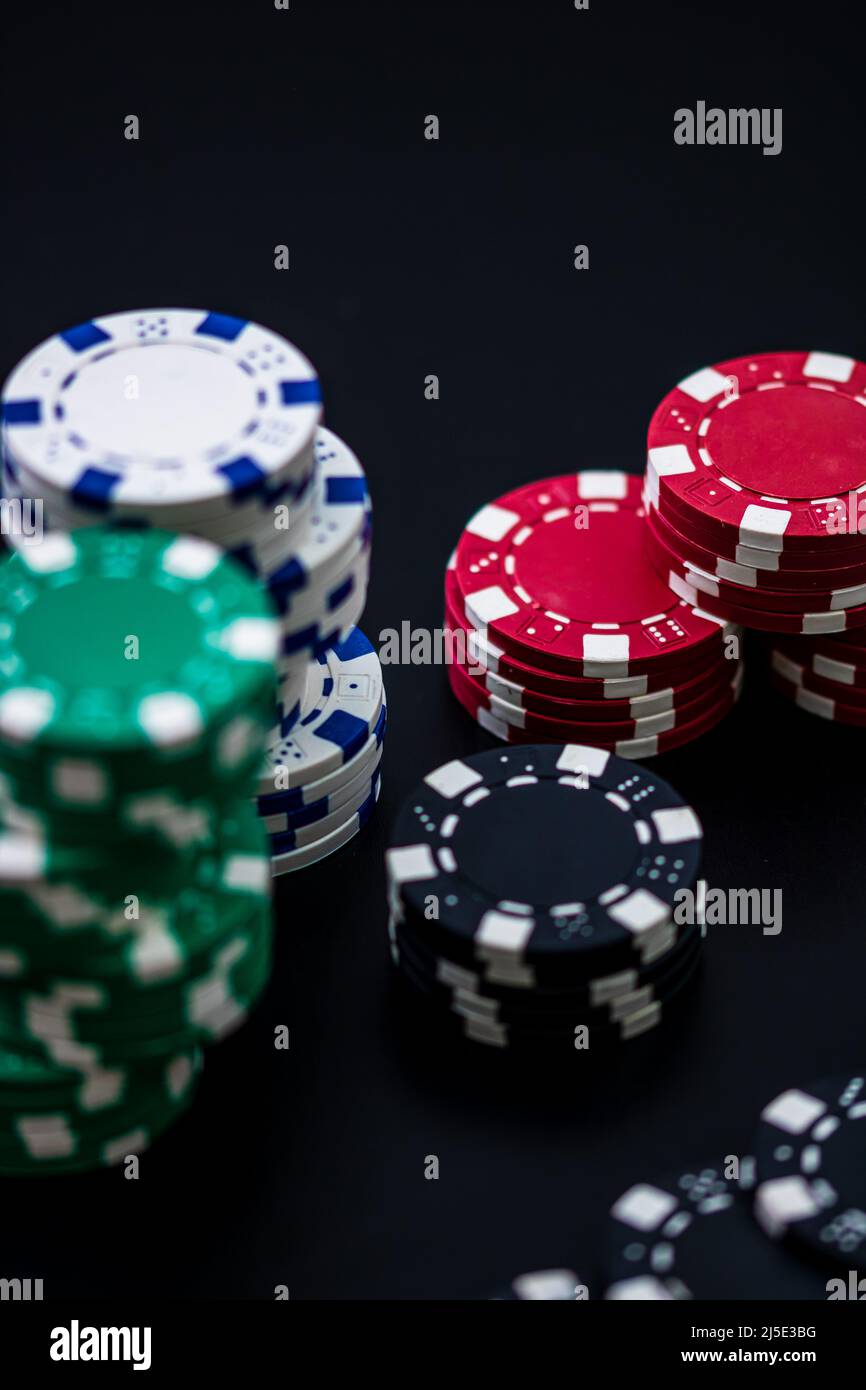 Stacks of poker chips detail with cards Stock Photo - Alamy