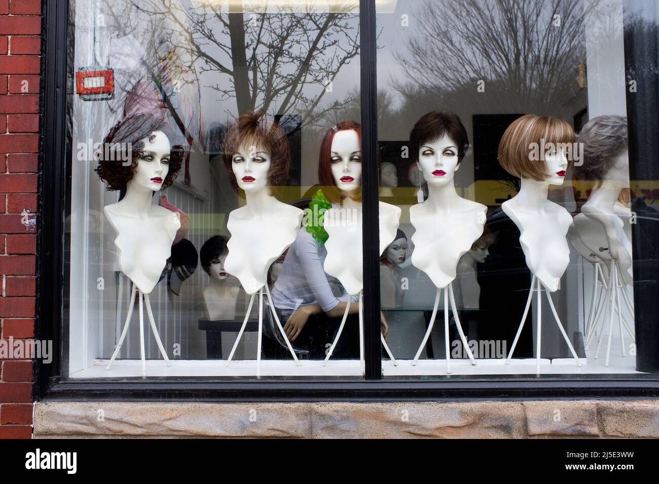Wigs on Display in Store Window Stock Photo - Alamy