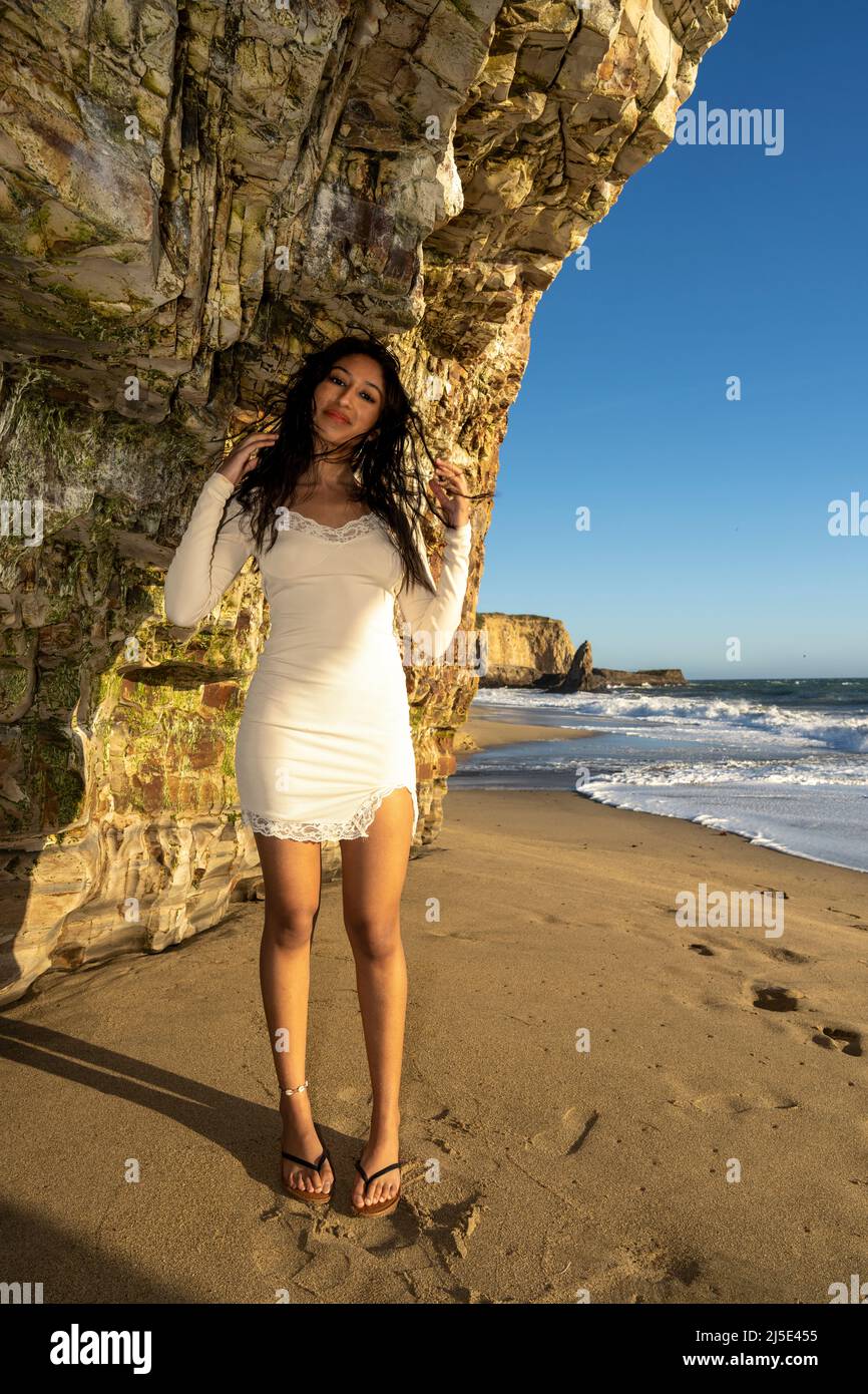 California Beach Lifestyle | Young woman at an entrance to a cave at ...