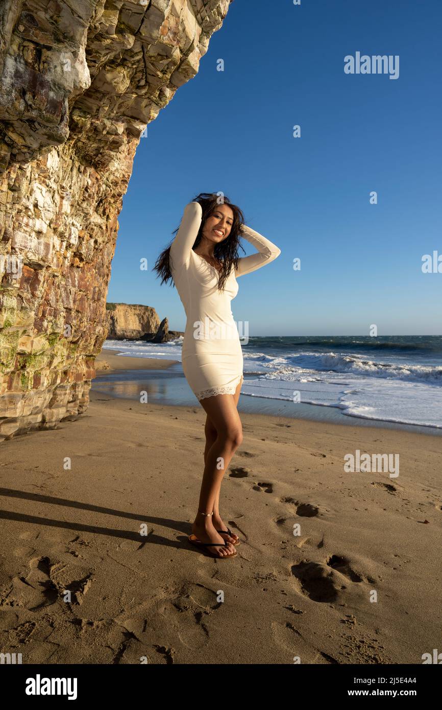 California Beach Lifestyle | Young woman at an entrance to a cave at ...