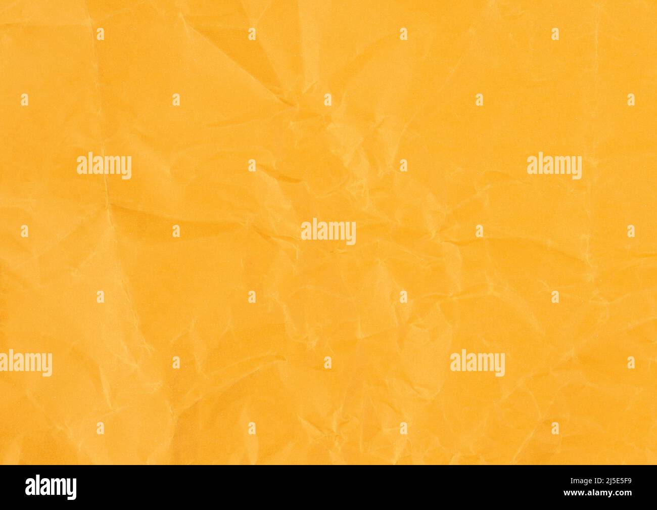 Wrinkled sheet of yellow paper. Textured backdrop Stock Photo - Alamy