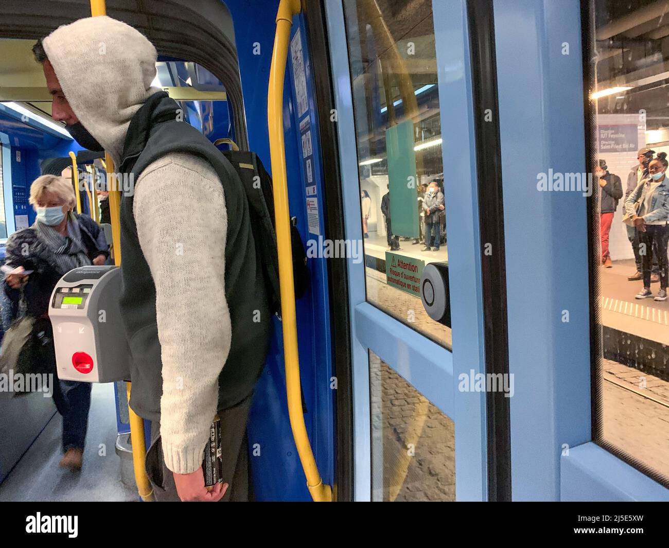 Drunk man standing in a tram train, Lyon, France Stock Photo - Alamy