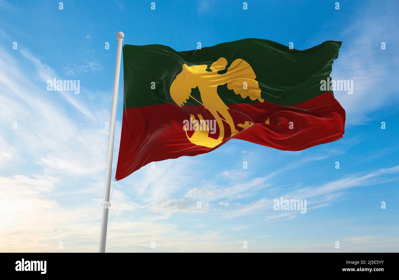 official flag of Brussel stad, Belgium at cloudy sky background on ...