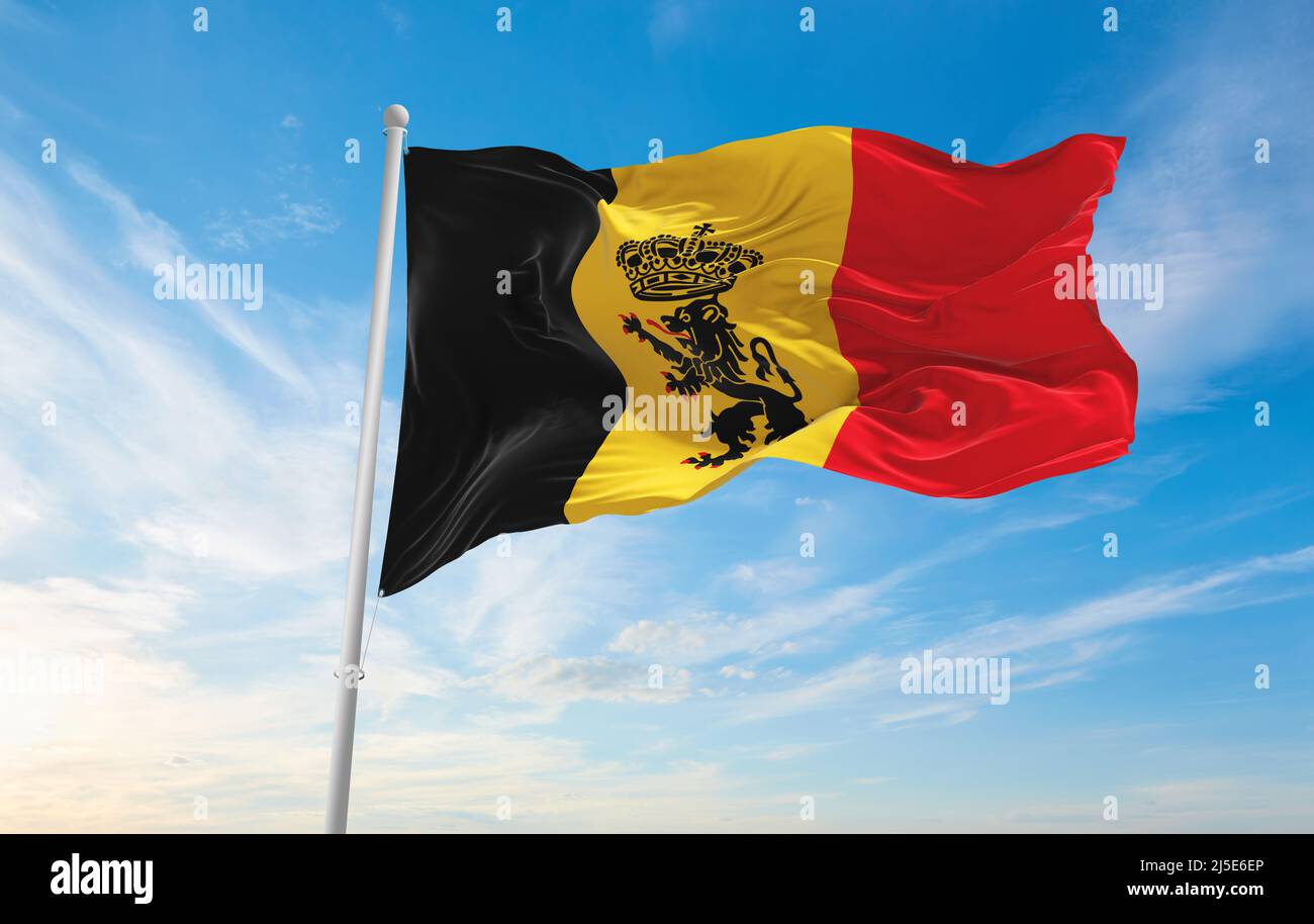 official flag of Government Ensign , Belgium at cloudy sky background ...