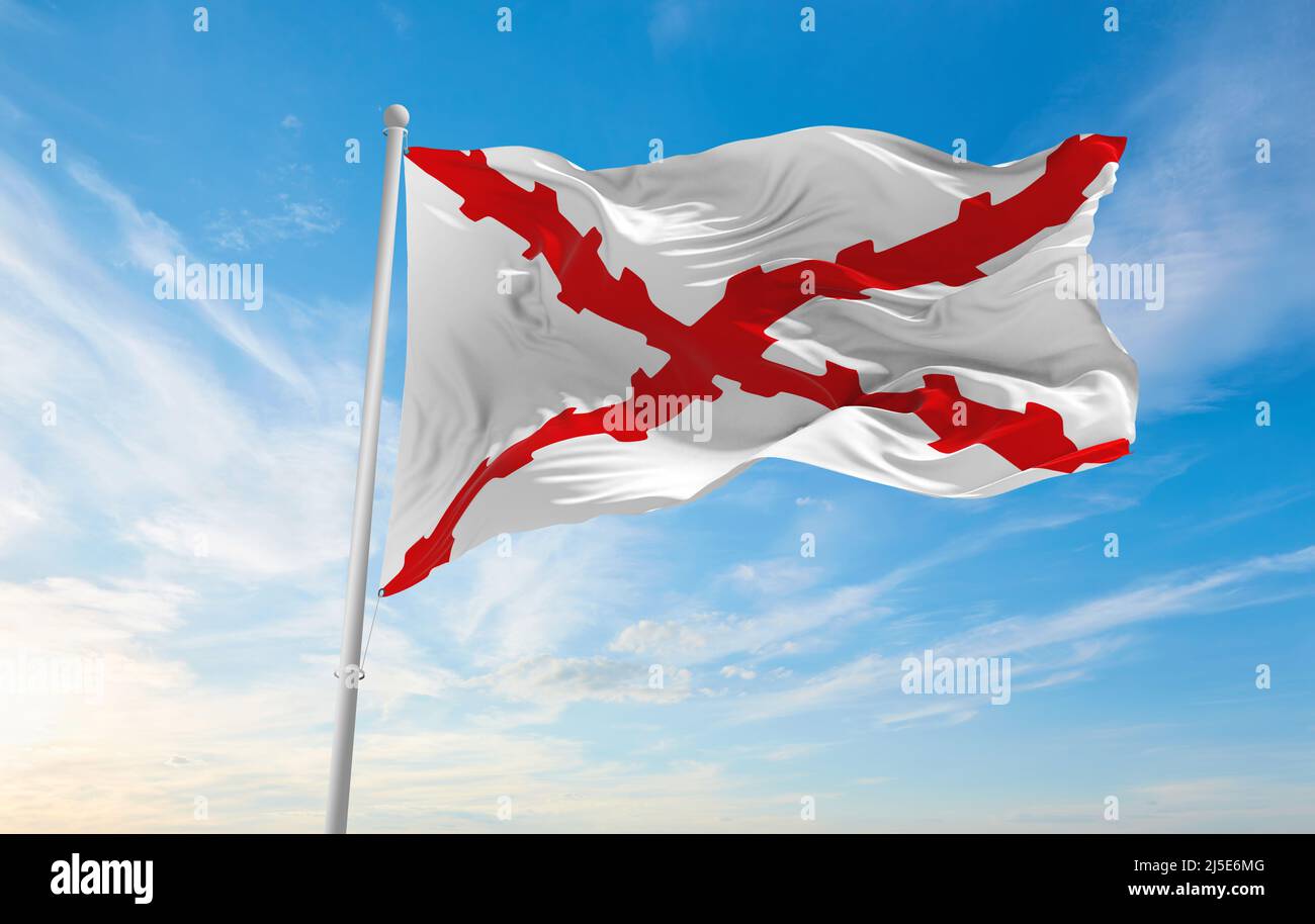 official flag of Low Countries, Belgium at cloudy sky background on ...