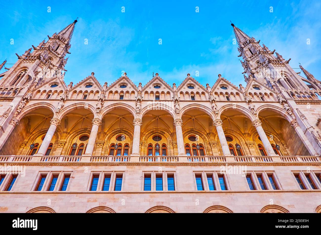 The Gothic Parliament building with stone carvings, towers, arches and ...