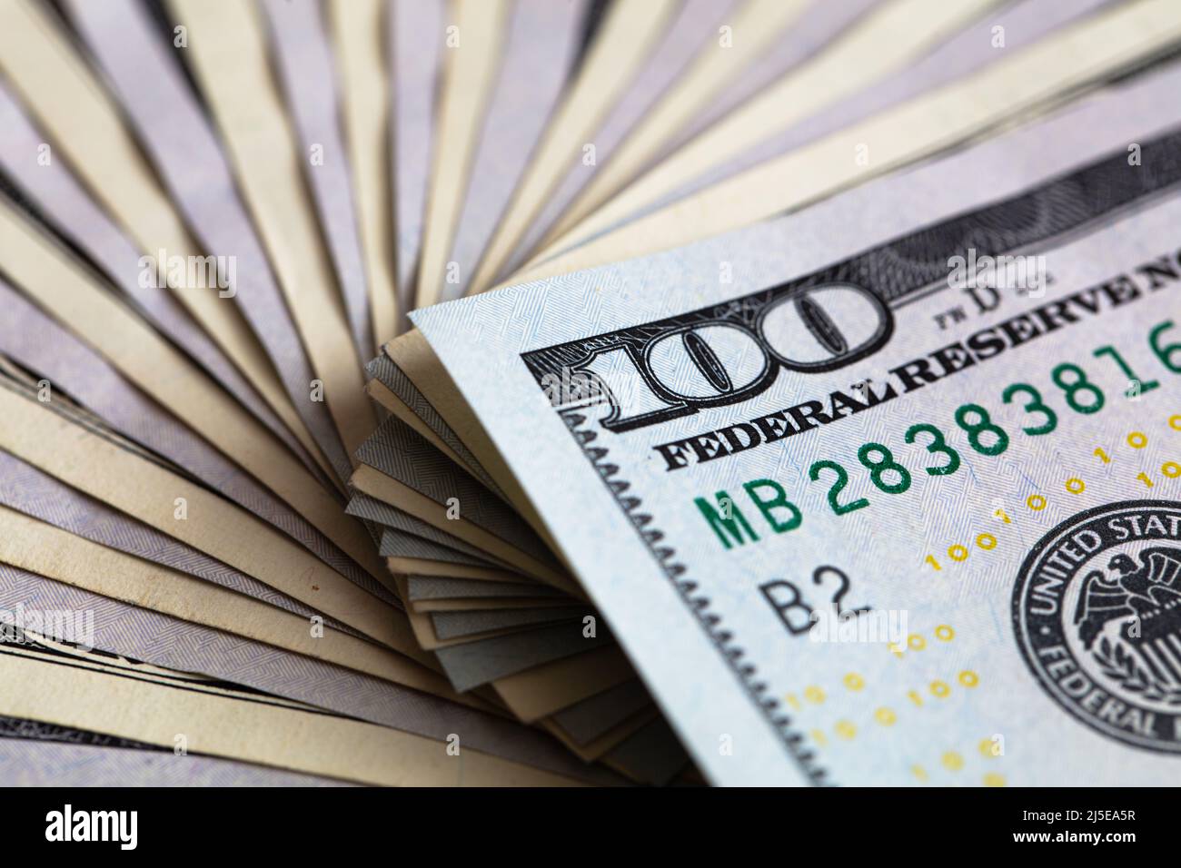 Fan of US 100 dollar banknotes for design purpose Stock Photo - Alamy