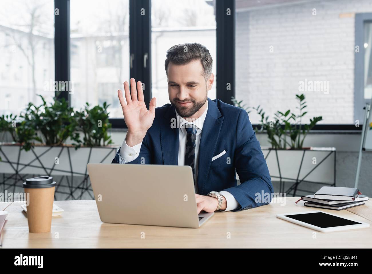 Office man waving hand hi-res stock photography and images - Alamy