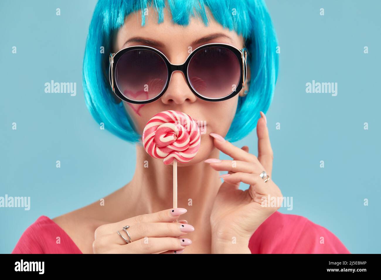 Candy Lolli pop Party Girl posing in blue studio. Role-playing games ...