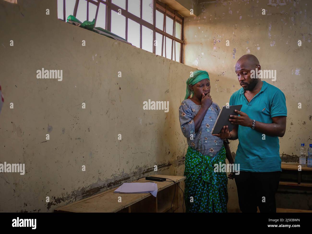 Nairobi, Kenya. 22nd Apr, 2022. A voter is shown how to pick an ...