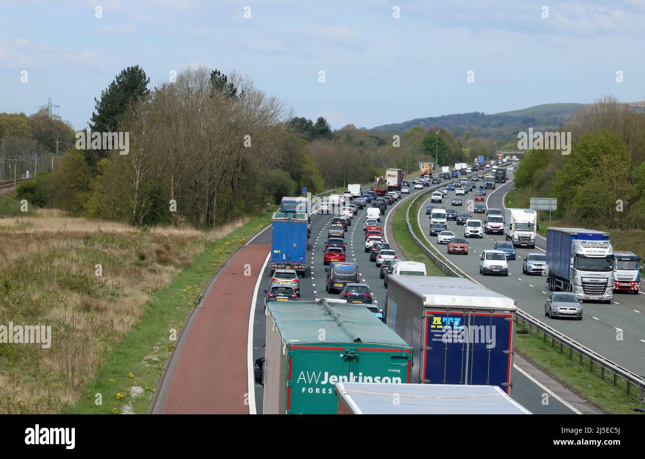 Slow moving traffic on M6 motorway in Lancashire countryside near ...