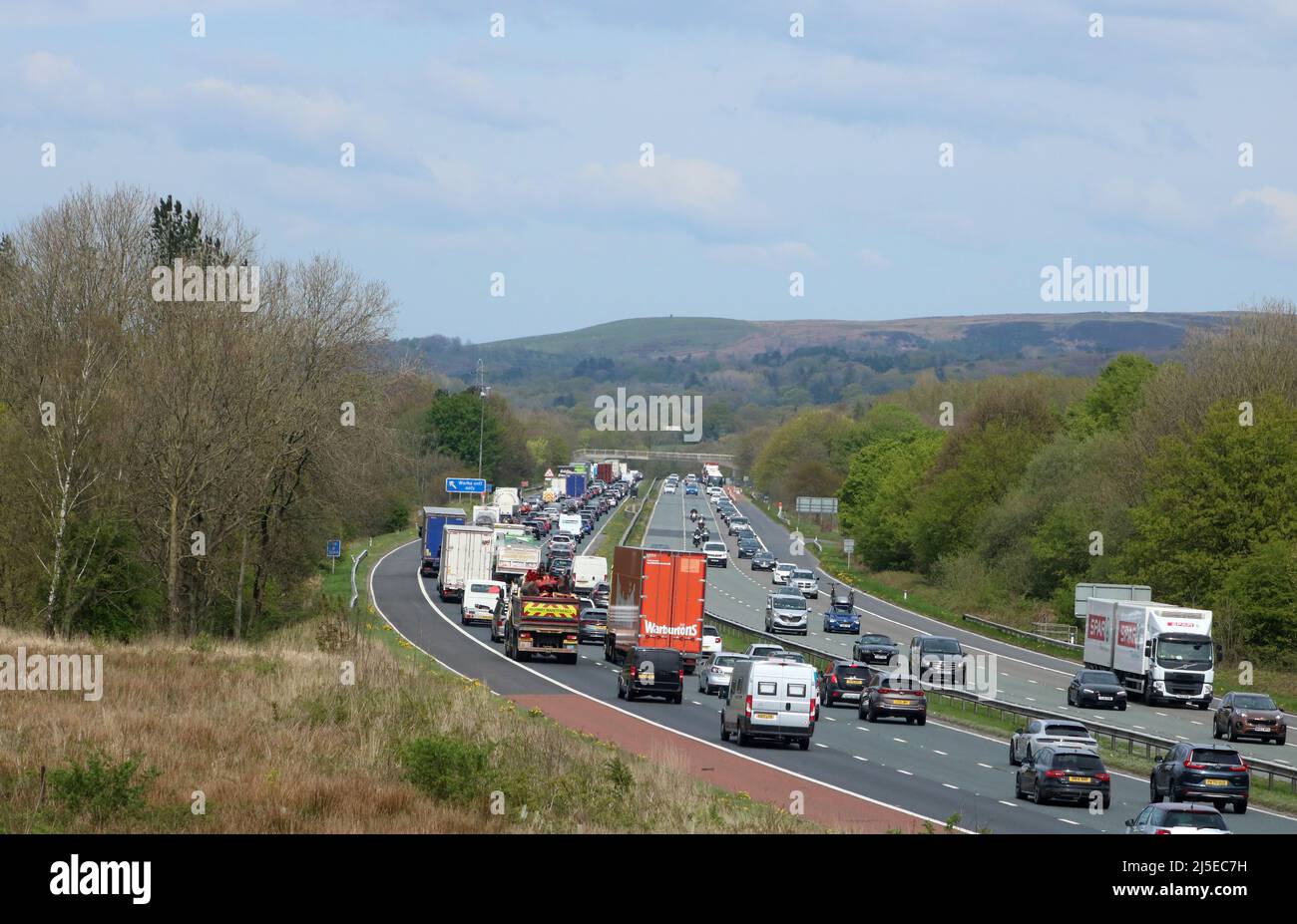 Slow moving traffic on M6 motorway in Lancashire countryside near ...
