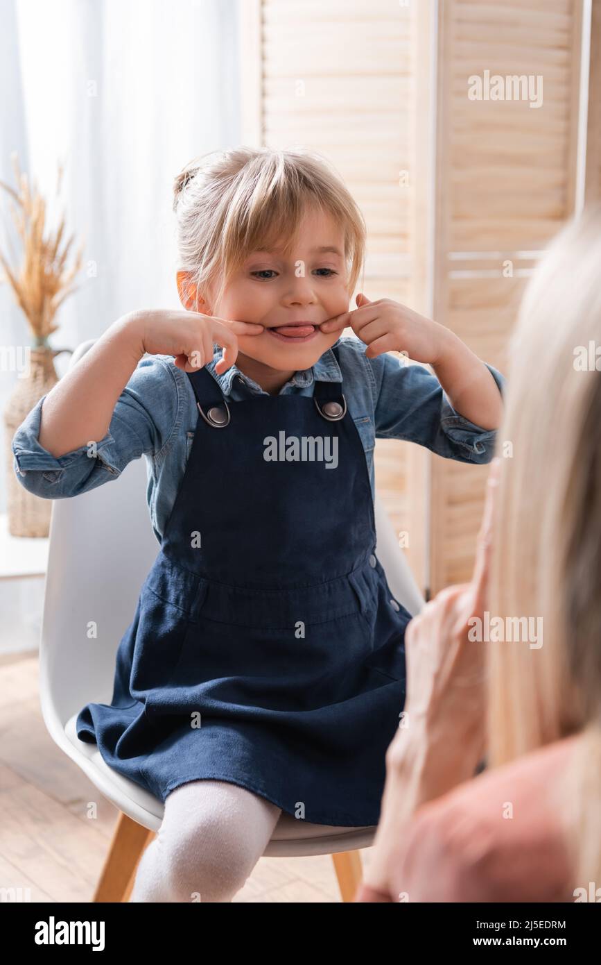 Child sticking out tongue hi-res stock photography and images - Alamy
