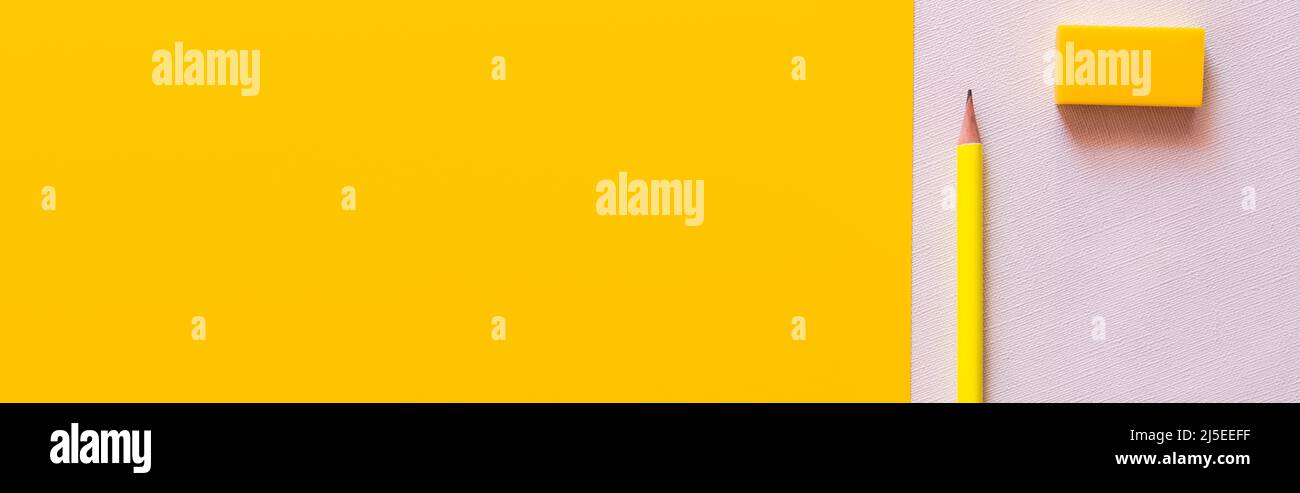 top view of pencil near eraser on white and yellow, banner Stock Photo ...