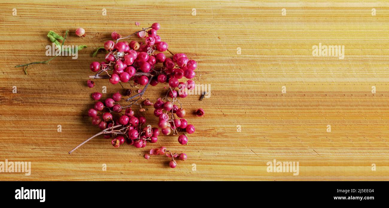 Pink peppercorns. Aromatic spice for food. Background of dried pink ...