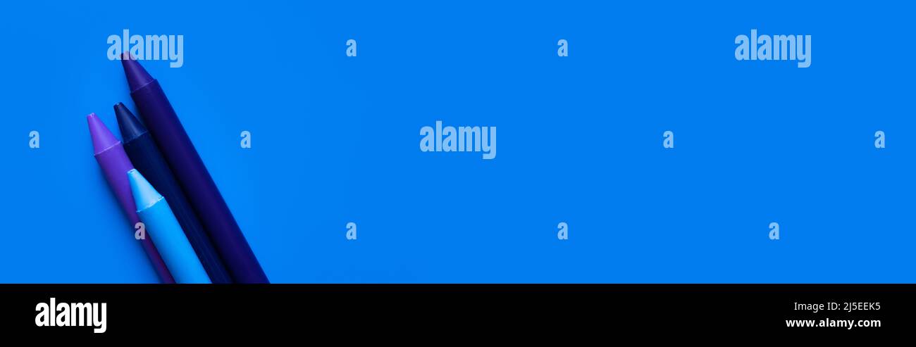 top view of blue gradient crayons on bright background, banner Stock ...
