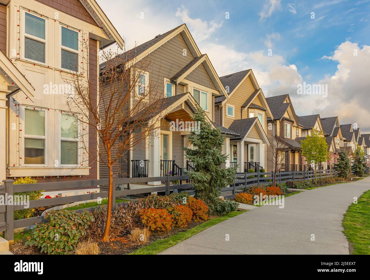 Neighborhood modern houses with spring flowers in BC, Canada. Canadian ...