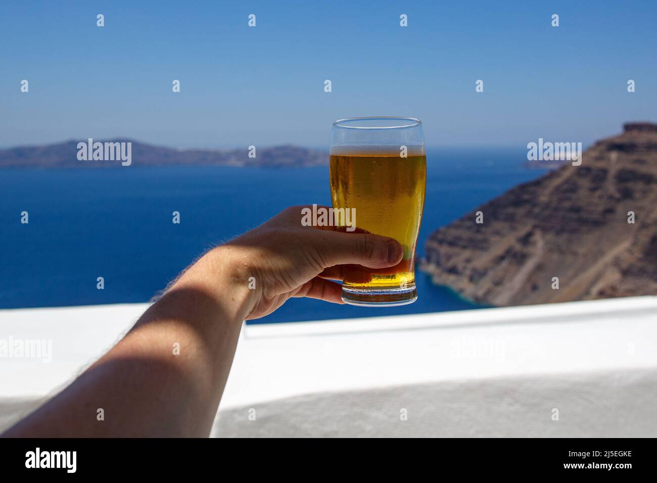Cold beer glass on the blue sea background Stock Photo - Alamy