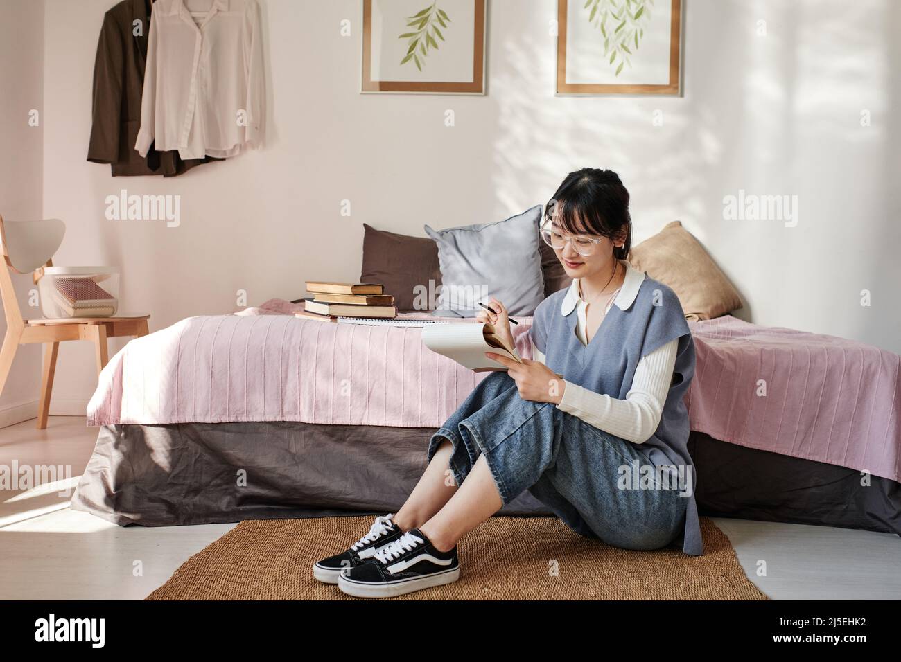 Chinese girl reading on sofa hi-res stock photography and images - Alamy