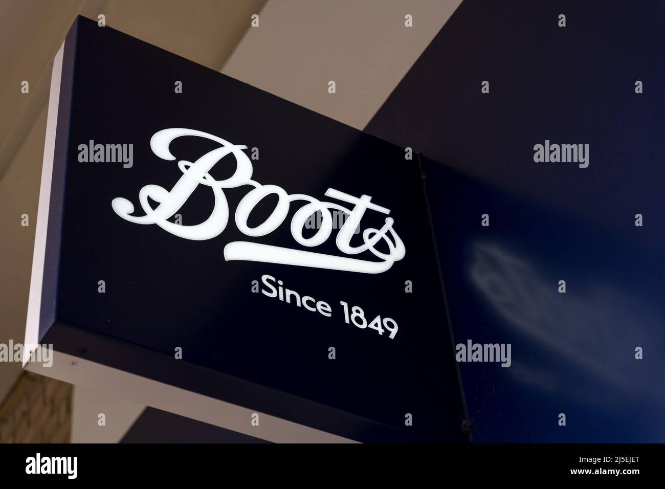 Shop logo for high street Pharmacy Boots, white lettering in dark blue ...