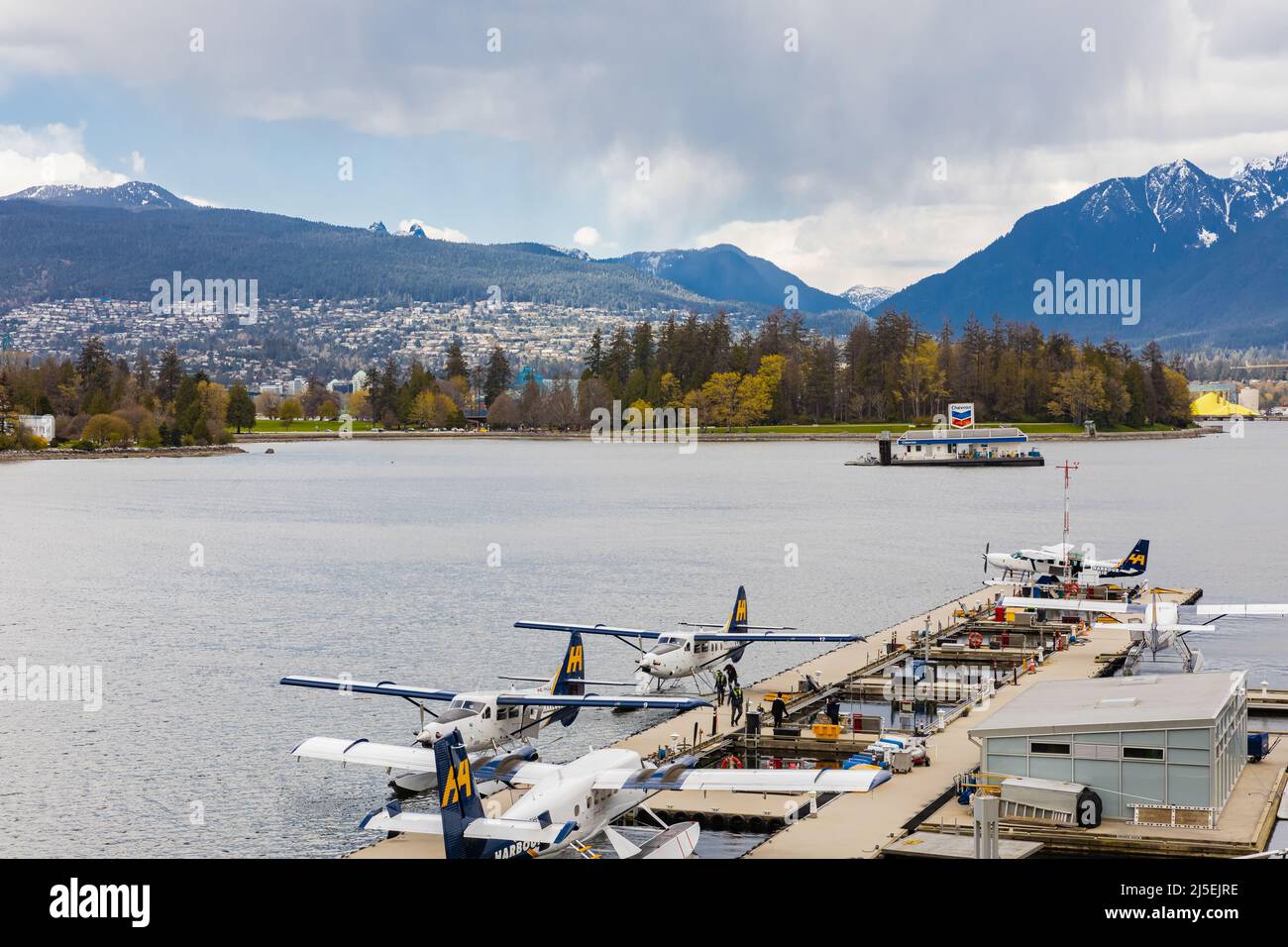 Float planes docked at Vancouver's Harbour Airport in overcast day. Air ...