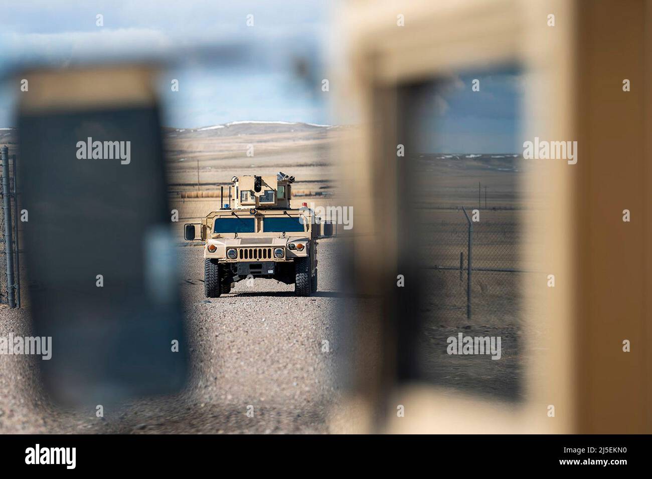 A Humvee enters the gates of a missile launch facility during a ...