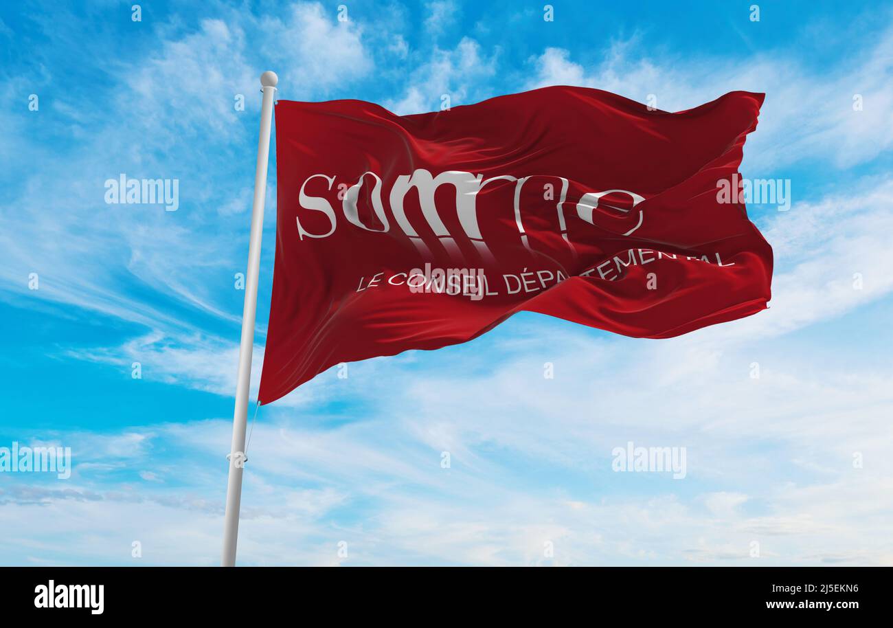 flag of department of Somme, France at cloudy sky background on sunset ...