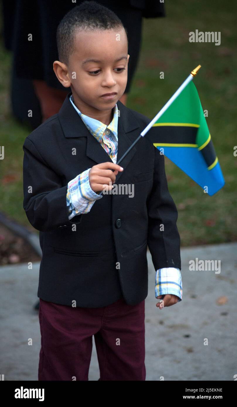 A young boy holding a Tanzanian flag at the premiere of Tanzania The ...