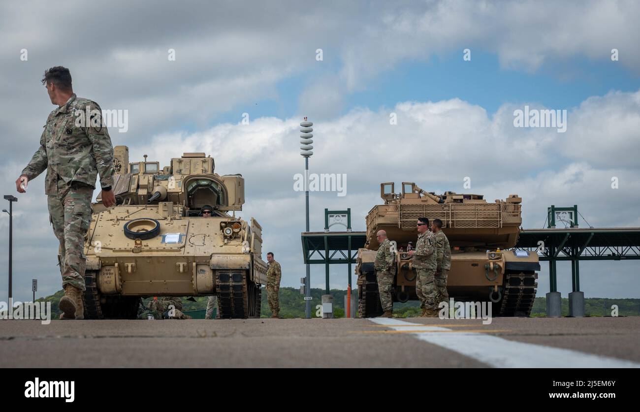 U.S. Army soldiers assigned to the 1st Cavalry Division direct an M1 ...