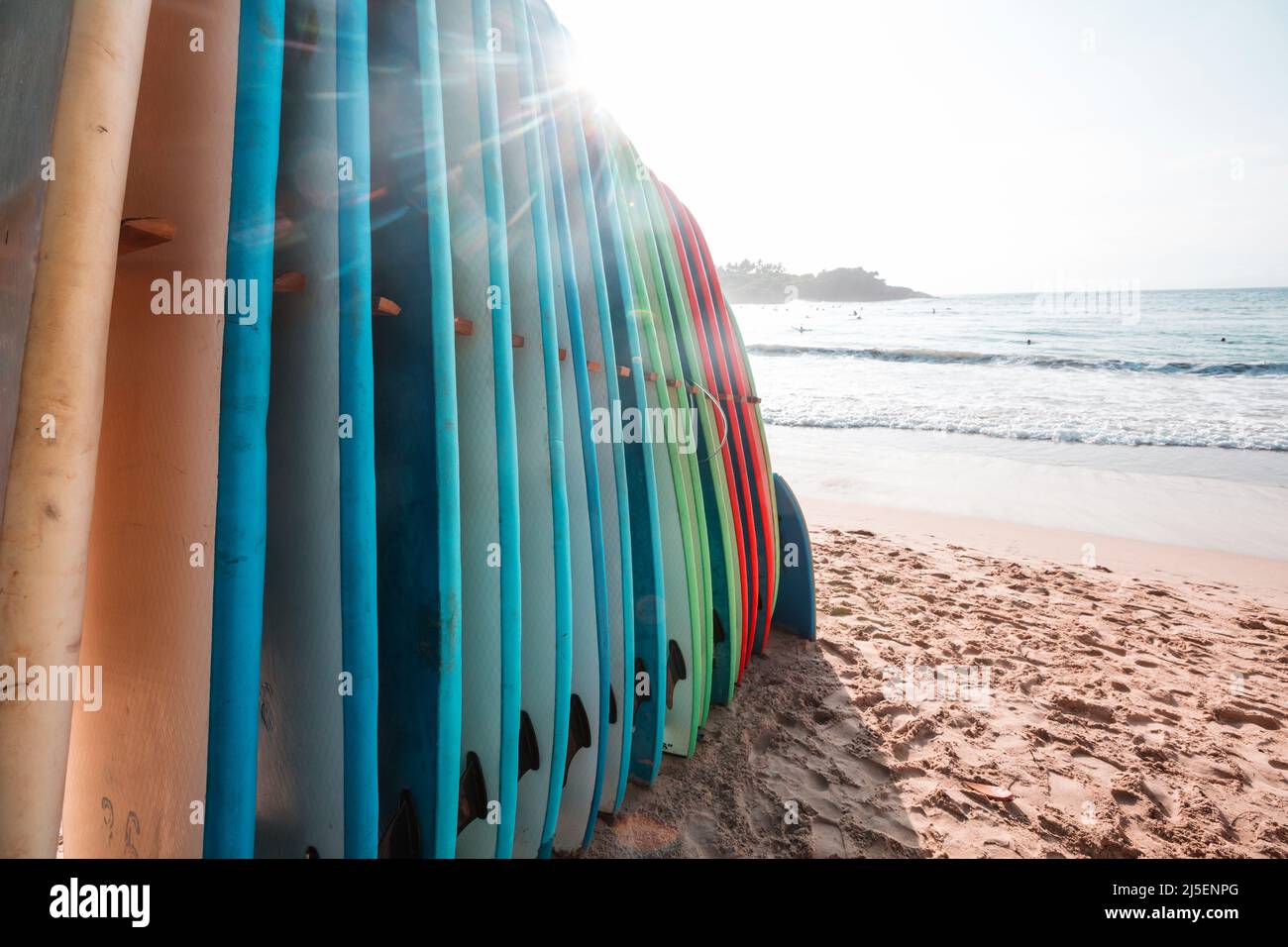 Surfing scene in ocean beach , sunrise time Stock Photo - Alamy