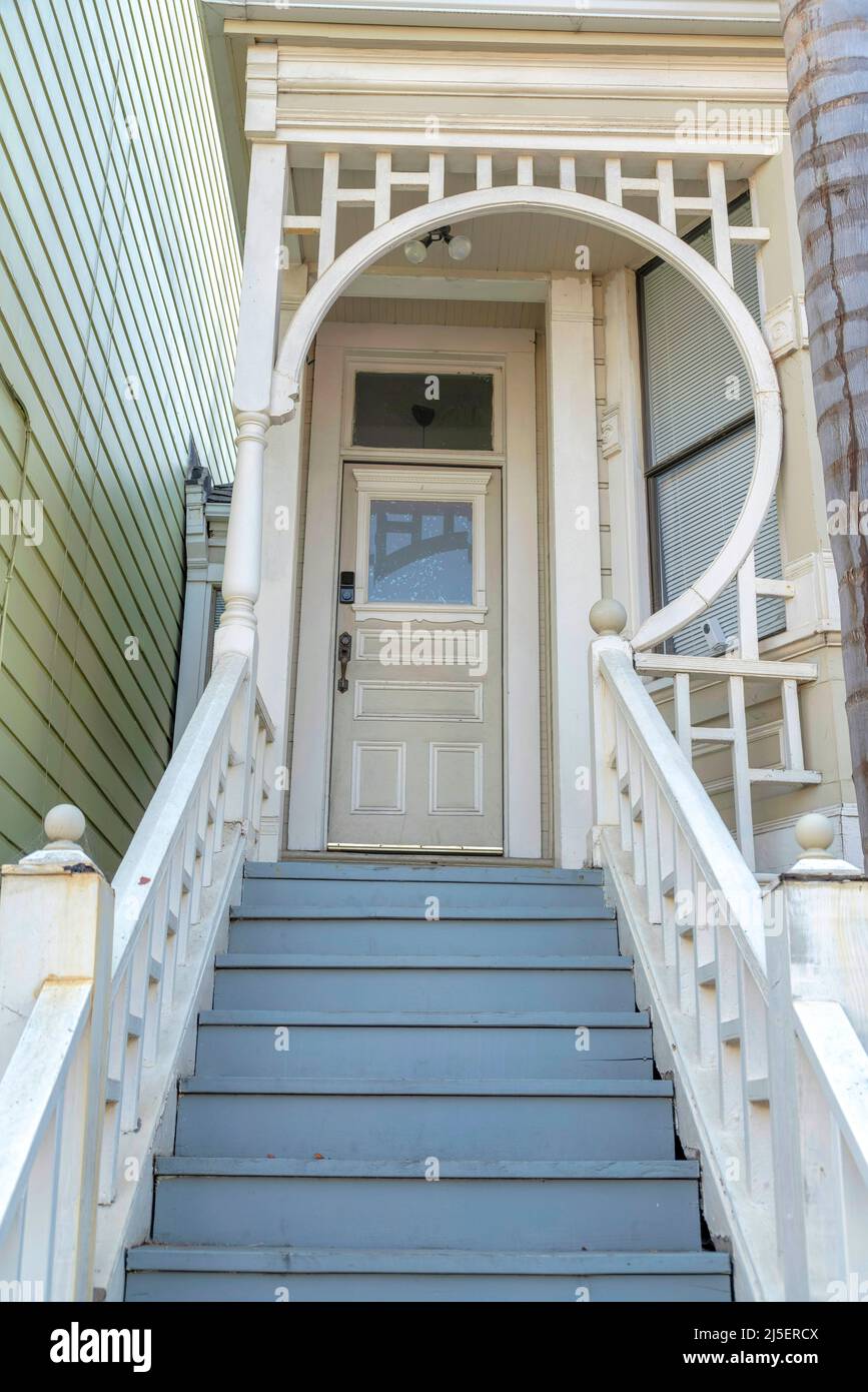 Wooden doorsteps with white handrails of a house at San Francisco ...