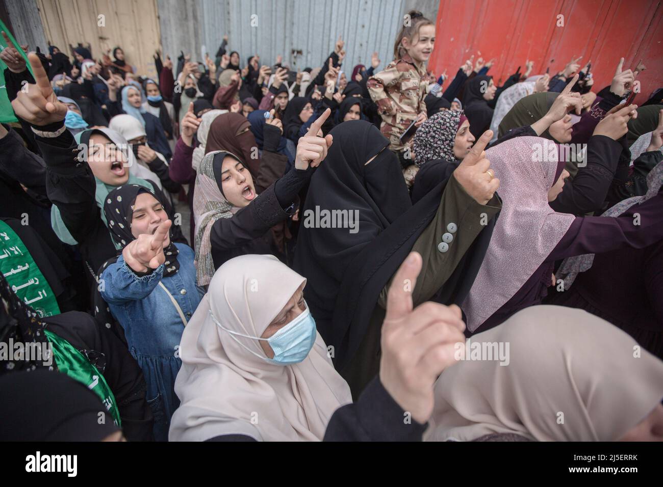 Palestinian supporters of the Islamic movement Hamas chant slogans ...