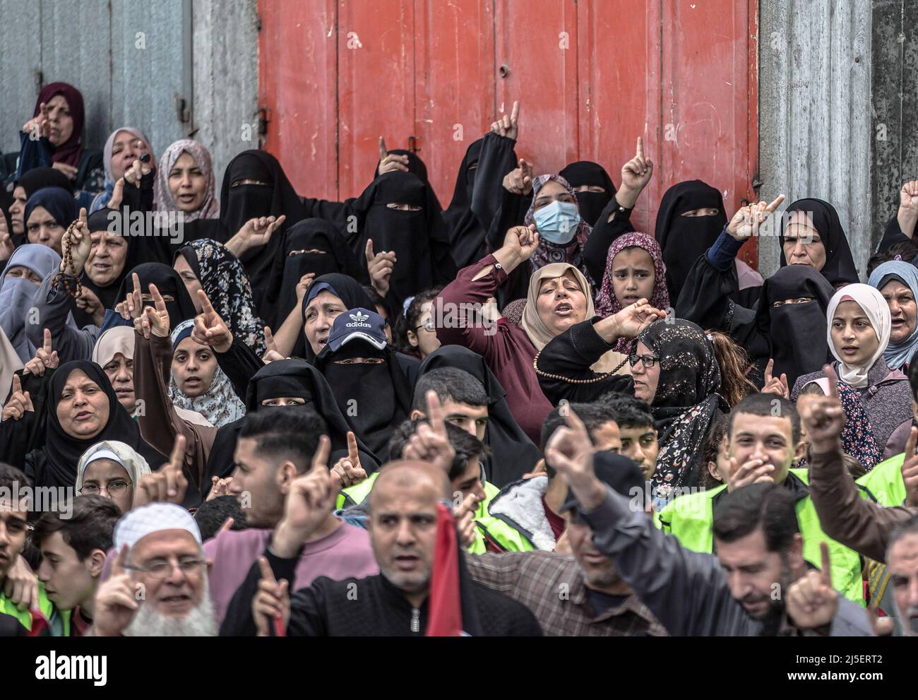 Palestinian supporters of the Islamic movement Hamas chant slogans ...