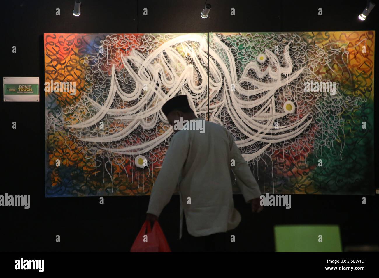 Jakarta, Indonesia. 22nd Apr, 2022. A visitor passes a contemporary art ...