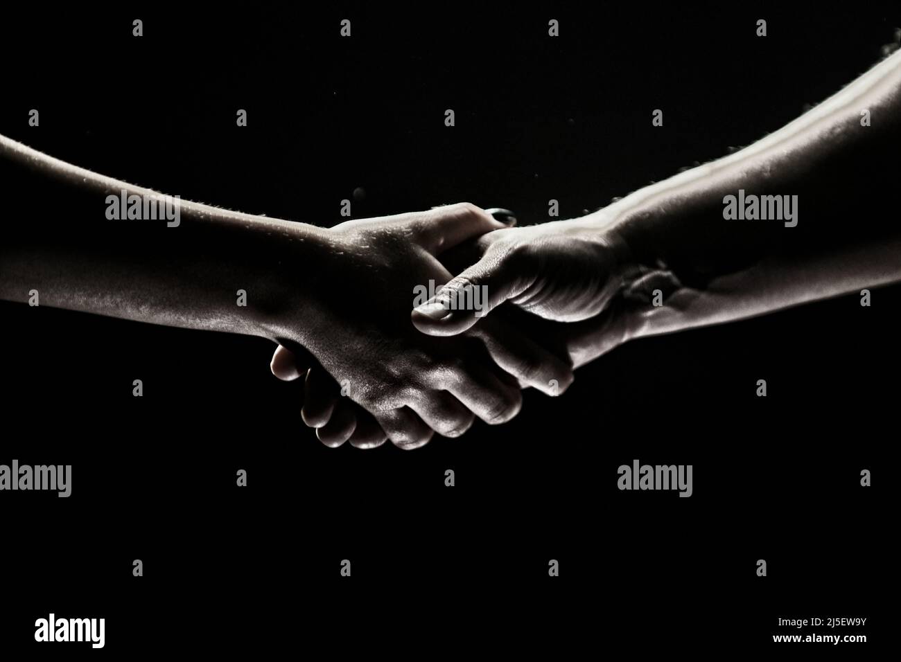 Hands gesturing on black background. Giving a helping hand. Support and ...