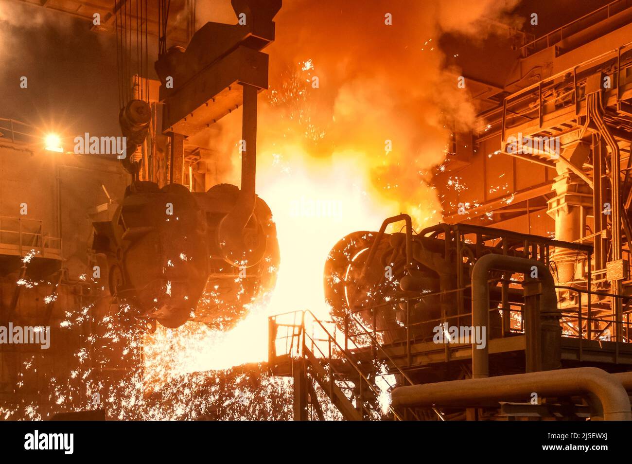 Liquid steel is poured from a metallurgical ladle Stock Photo - Alamy