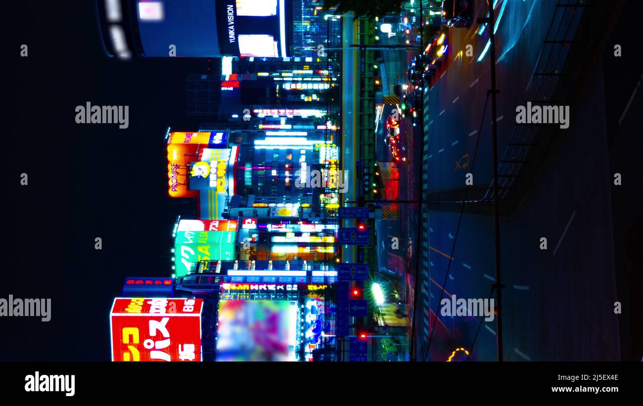 A timelapse of the street at the neon town in Shinjuku Tokyo vertical ...