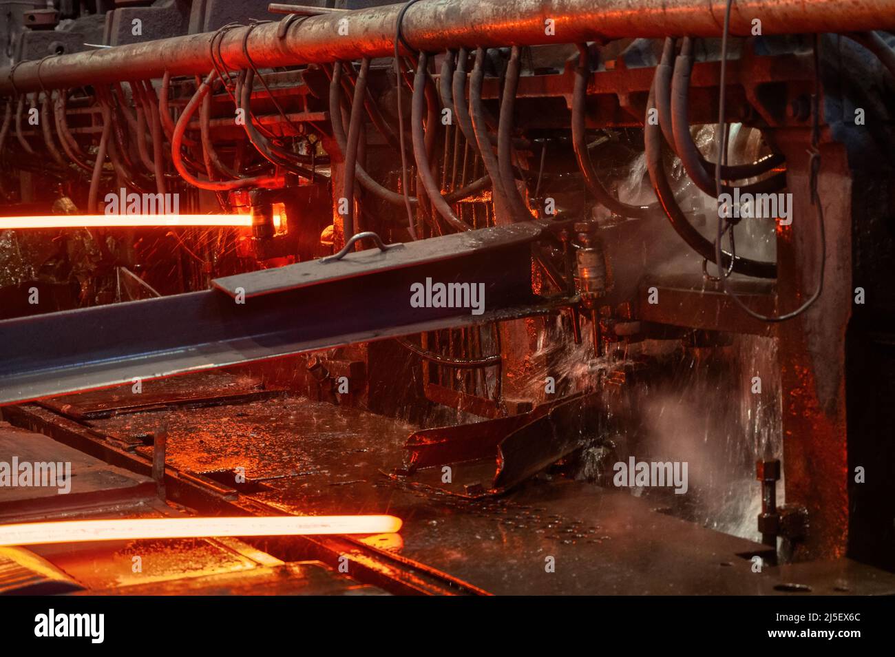 The process of rolling hot rolled steel in a rolling mill Stock Photo ...